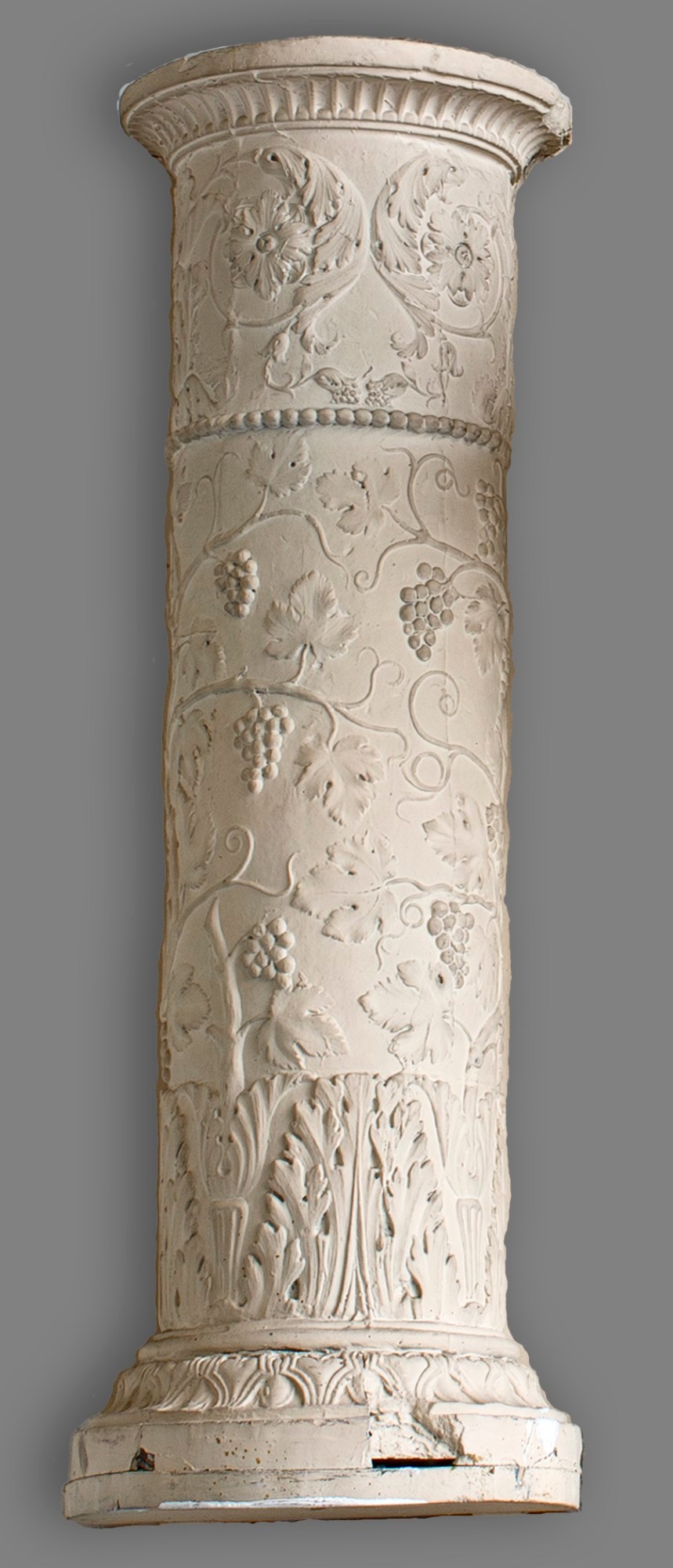 Cast of column base and lowest part of column with scrolling decoration ...